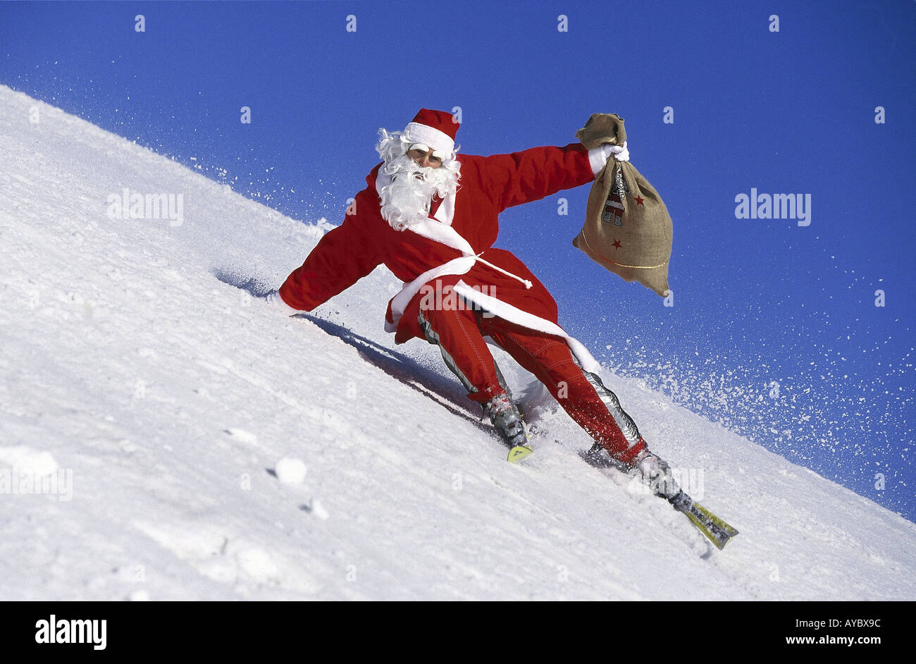 Male santa skiing hi-res stock photography and images - Alamy