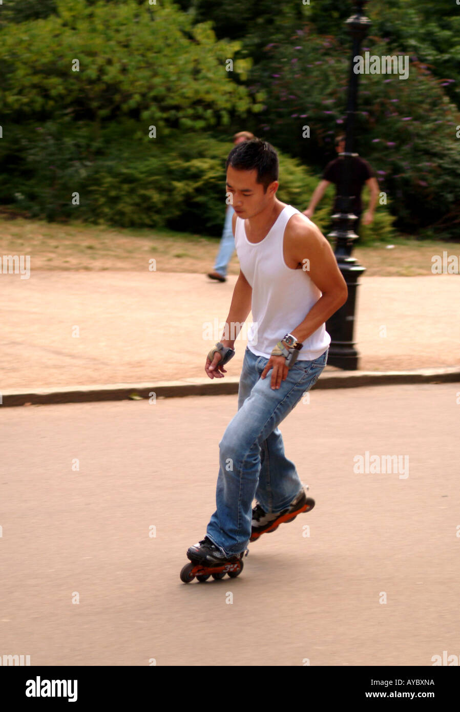 Man rollerblading in Hyde Park London Stock Photo - Alamy