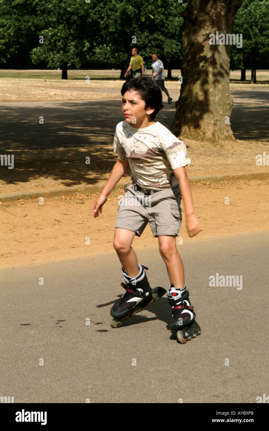 Boy rollerblading in Hyde Park London Stock Photo - Alamy