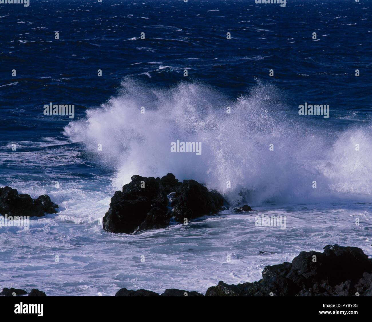 Wave Crashing Against Rocks Stock Photo - Alamy
