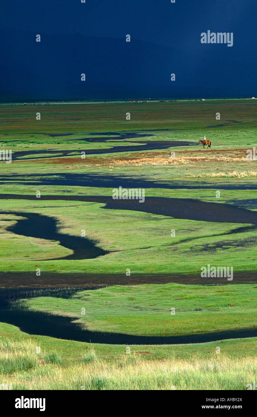 Mongolia, Steppeland. A lone Horse Herder out on the Steppeland Stock ...