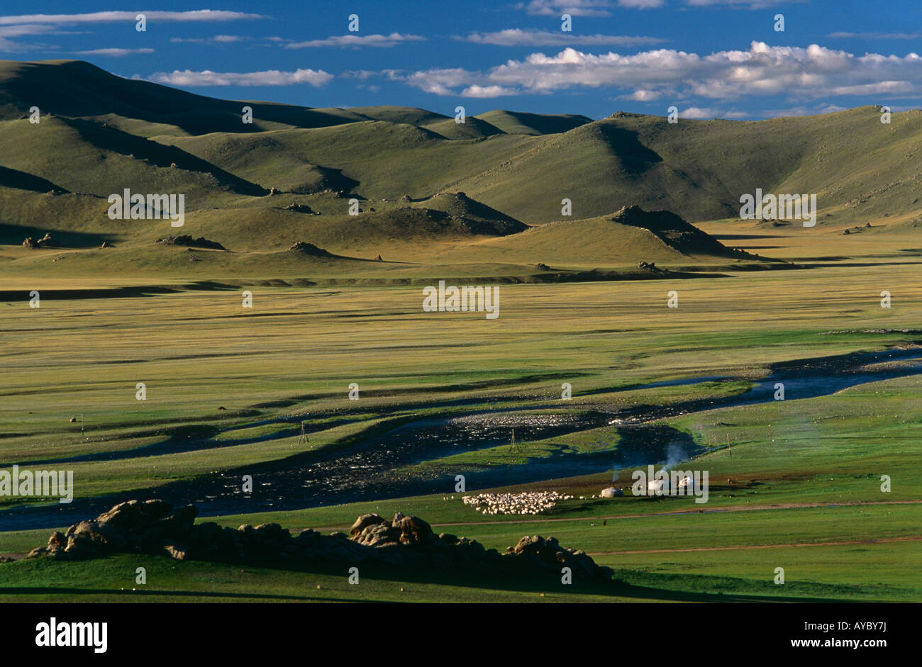 Mongolia, Steppeland. Yurts next to a river on the Steppeland Stock ...