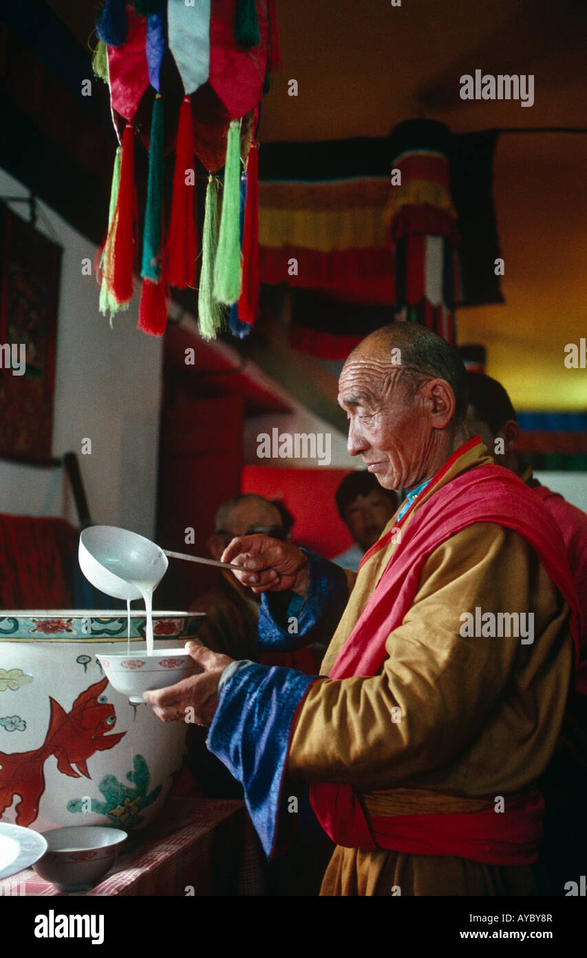 Mongolia, Karakorum. Lamas pouring Horses Milk (Koumiss) at Erdene Zuu ...