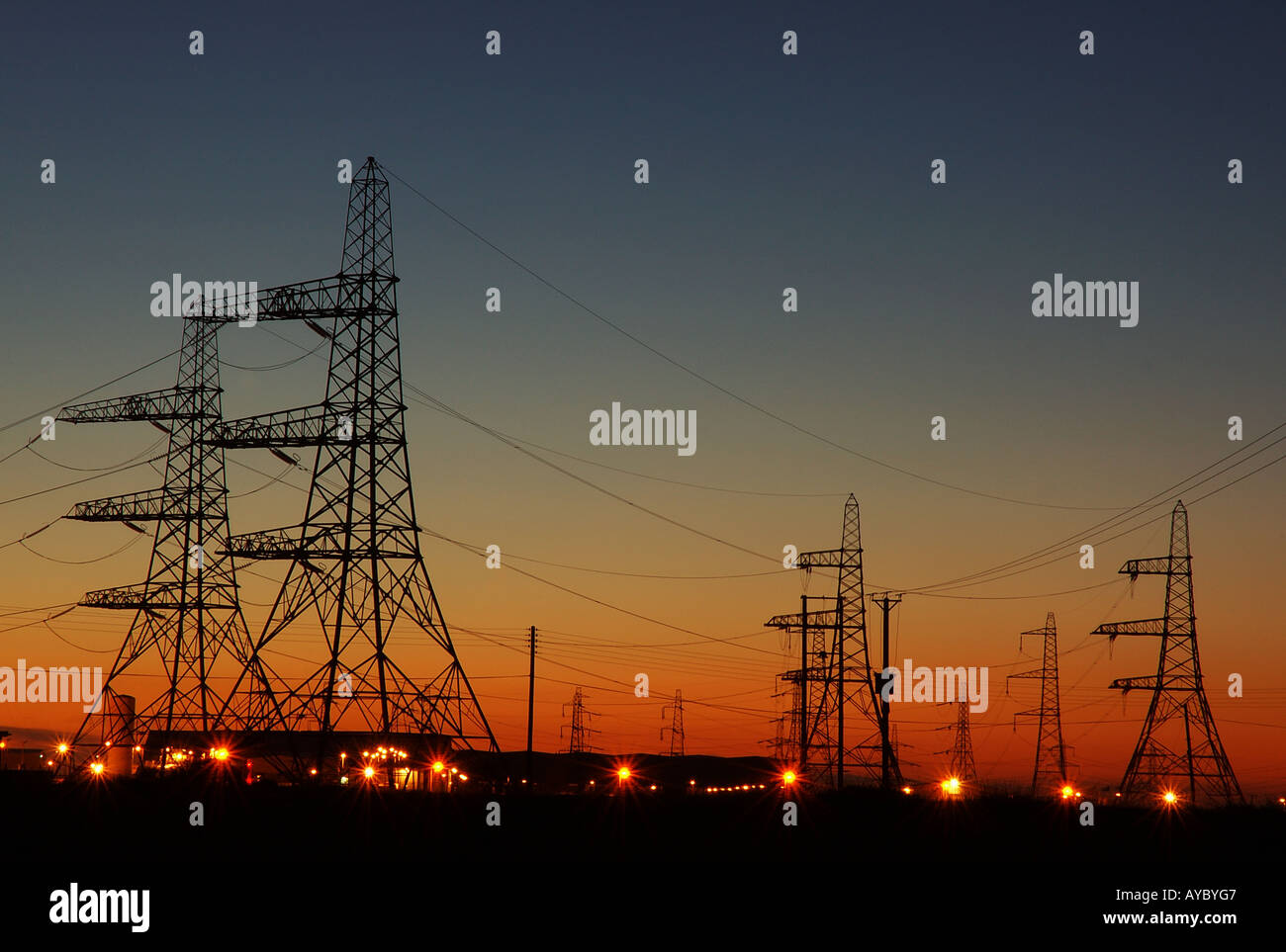 Electricity Pylons at dusk Stock Photo - Alamy