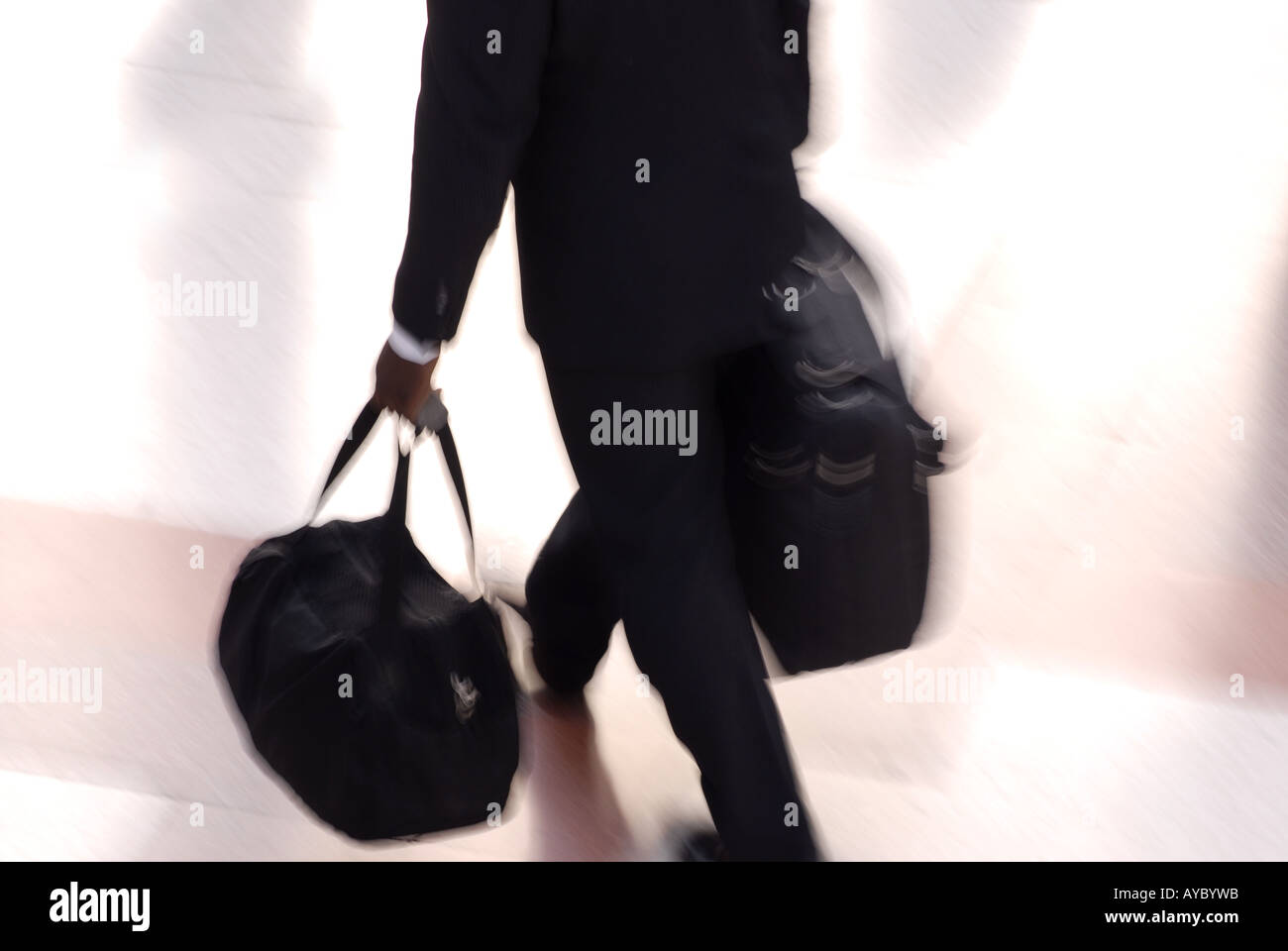 Commuter man at a railway station blurred image Stock Photo - Alamy
