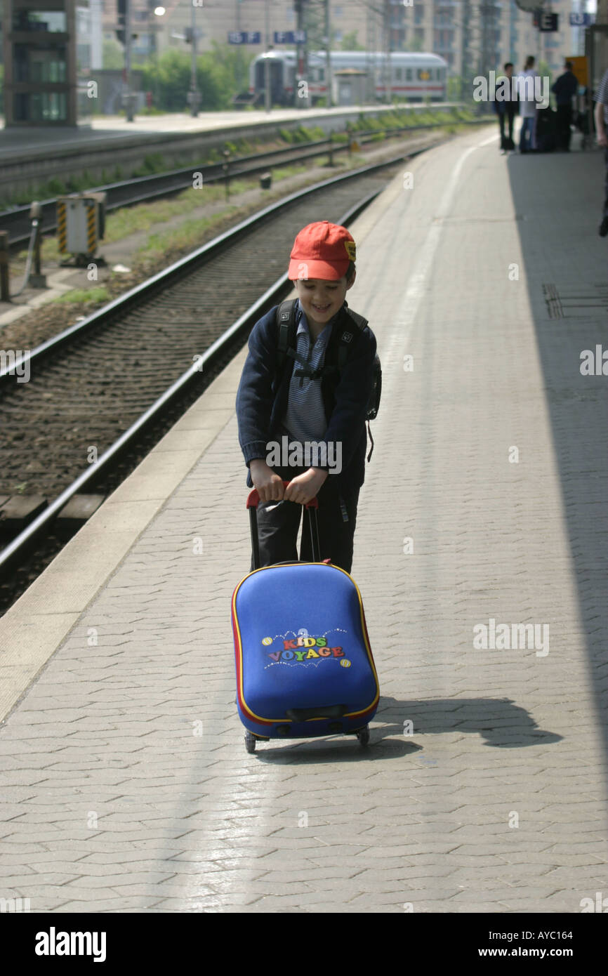 A 6 years old kid is waiting for the train at Germany Stock Photo - Alamy