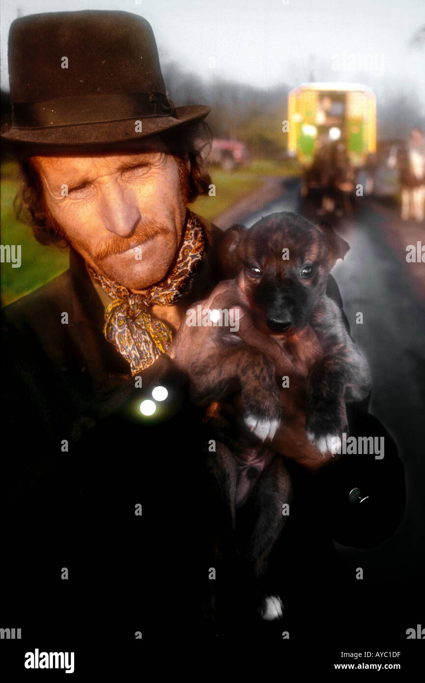 Gypsy father with puppy in Winter Dorset England UK Stock Photo - Alamy