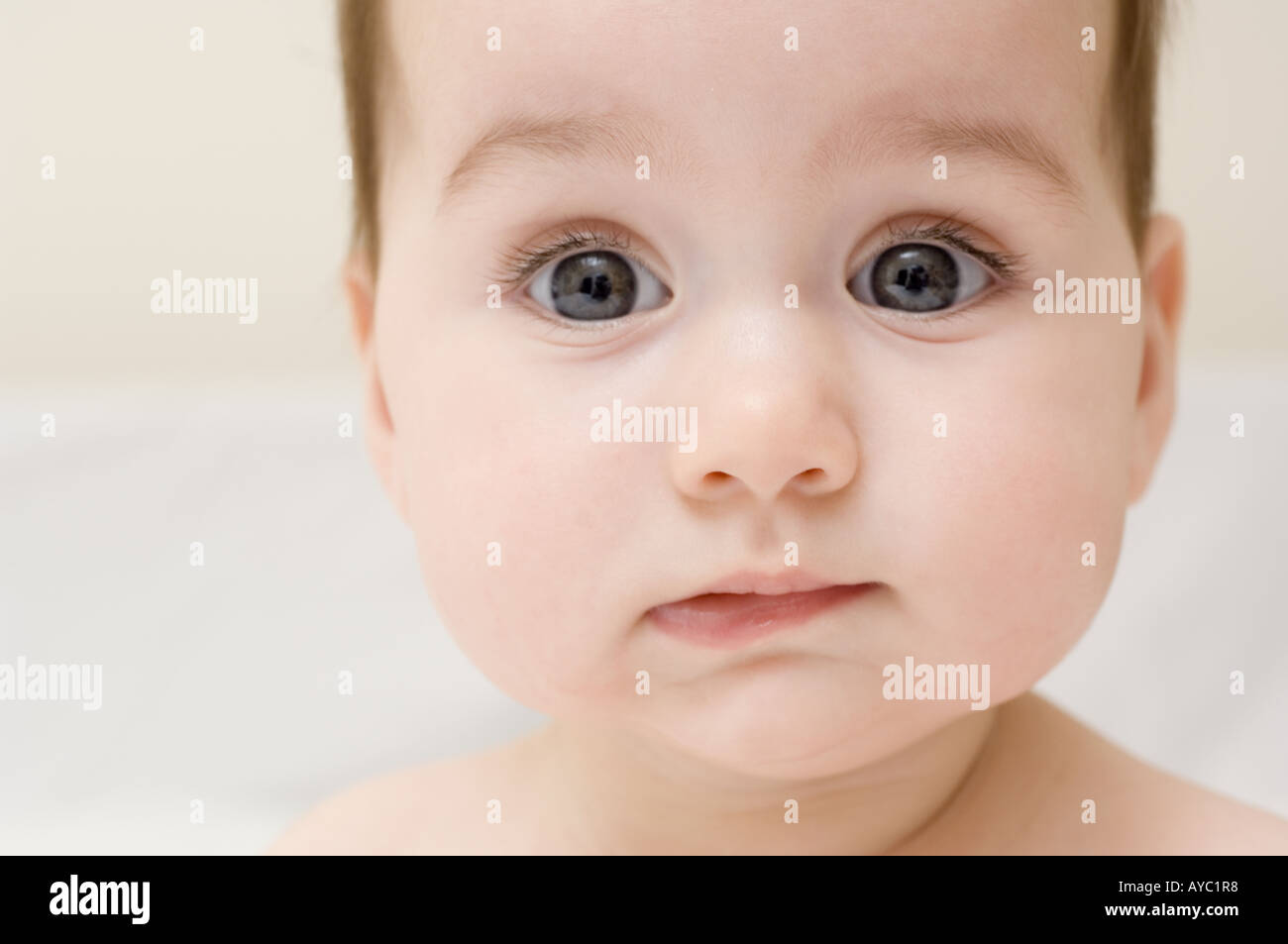 6 month baby girl with worried expression Stock Photo - Alamy