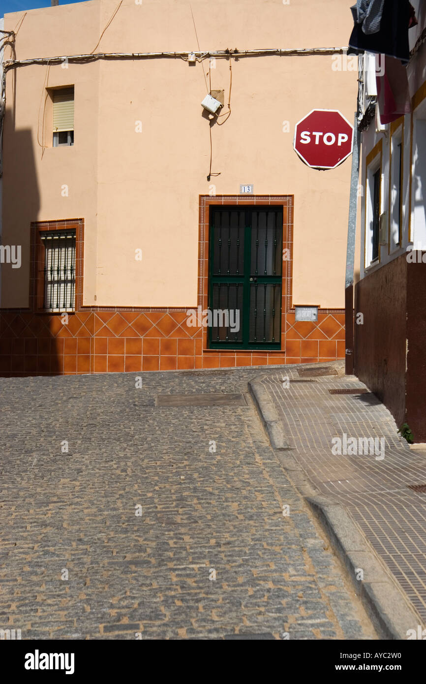 An empty cobblestone street in Ayamonte in Spain with a hexagonal stop ...