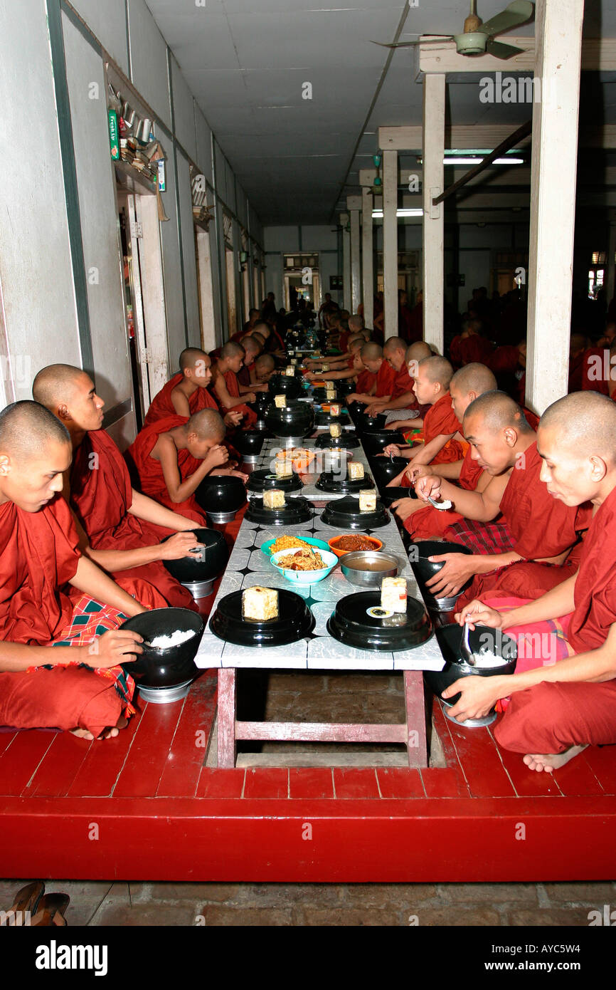 Buddhist monks eating at the Maha Ganayon monastery at Amarapura, near ...