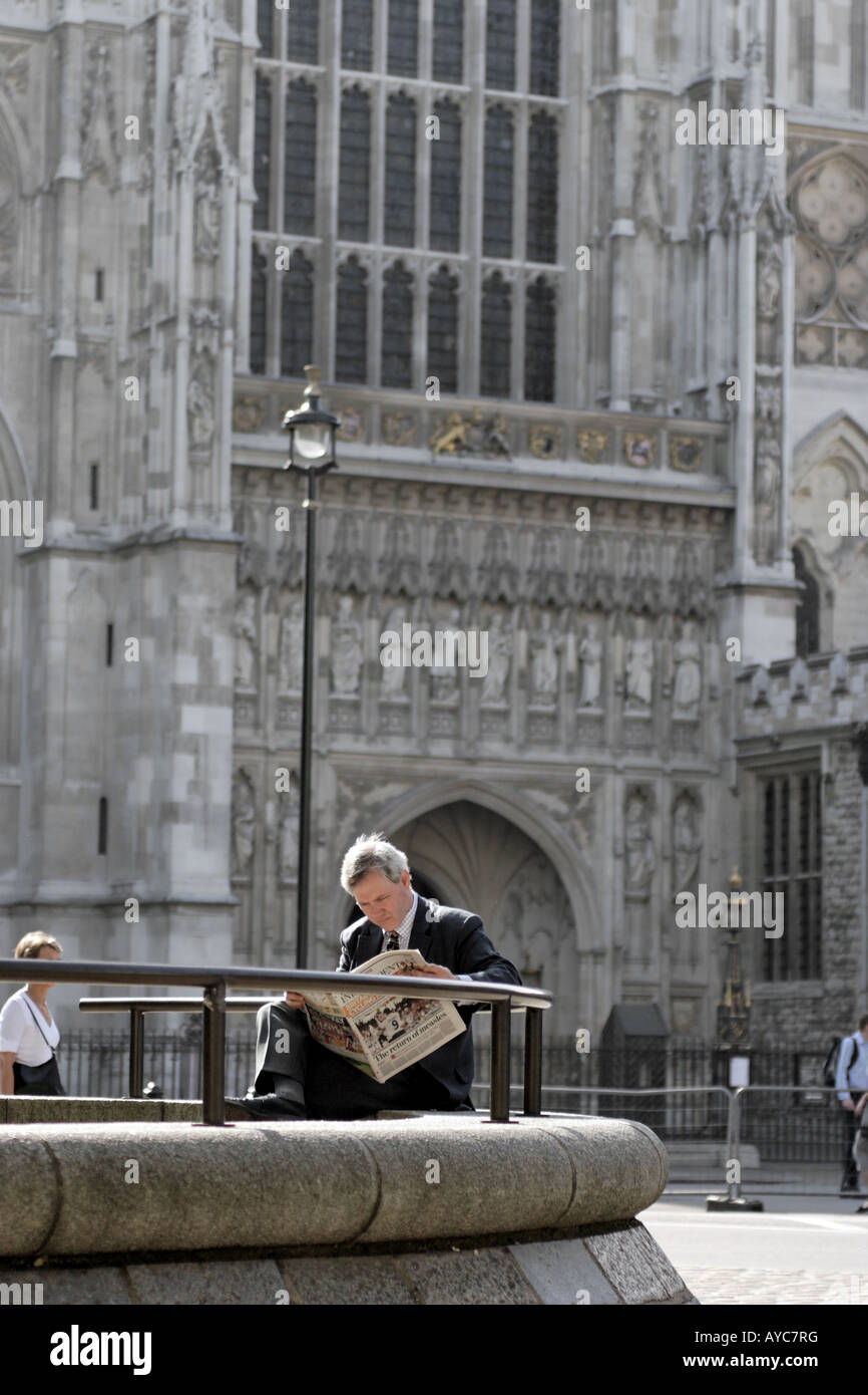 Businessman reading the Independent newspaper outside the Houses of ...
