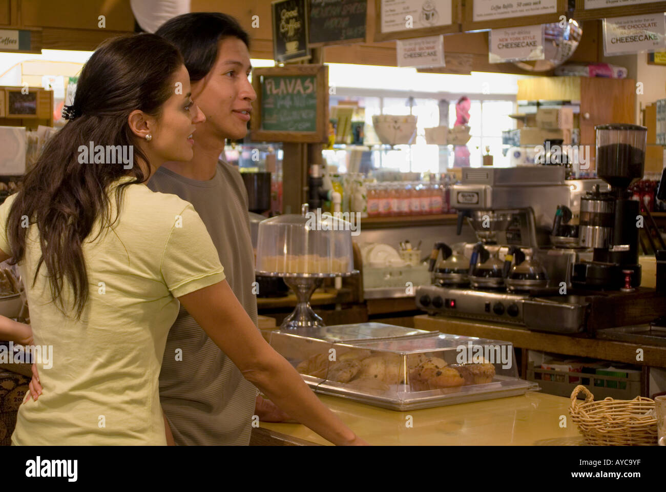 Couple ordering at front counter Stock Photo - Alamy