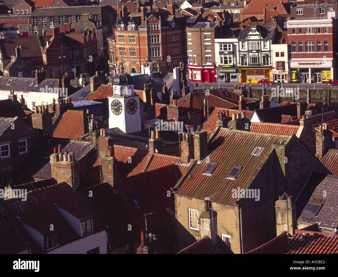 Whitby North Yorkshire Old town rooftops showing the old town clock ...