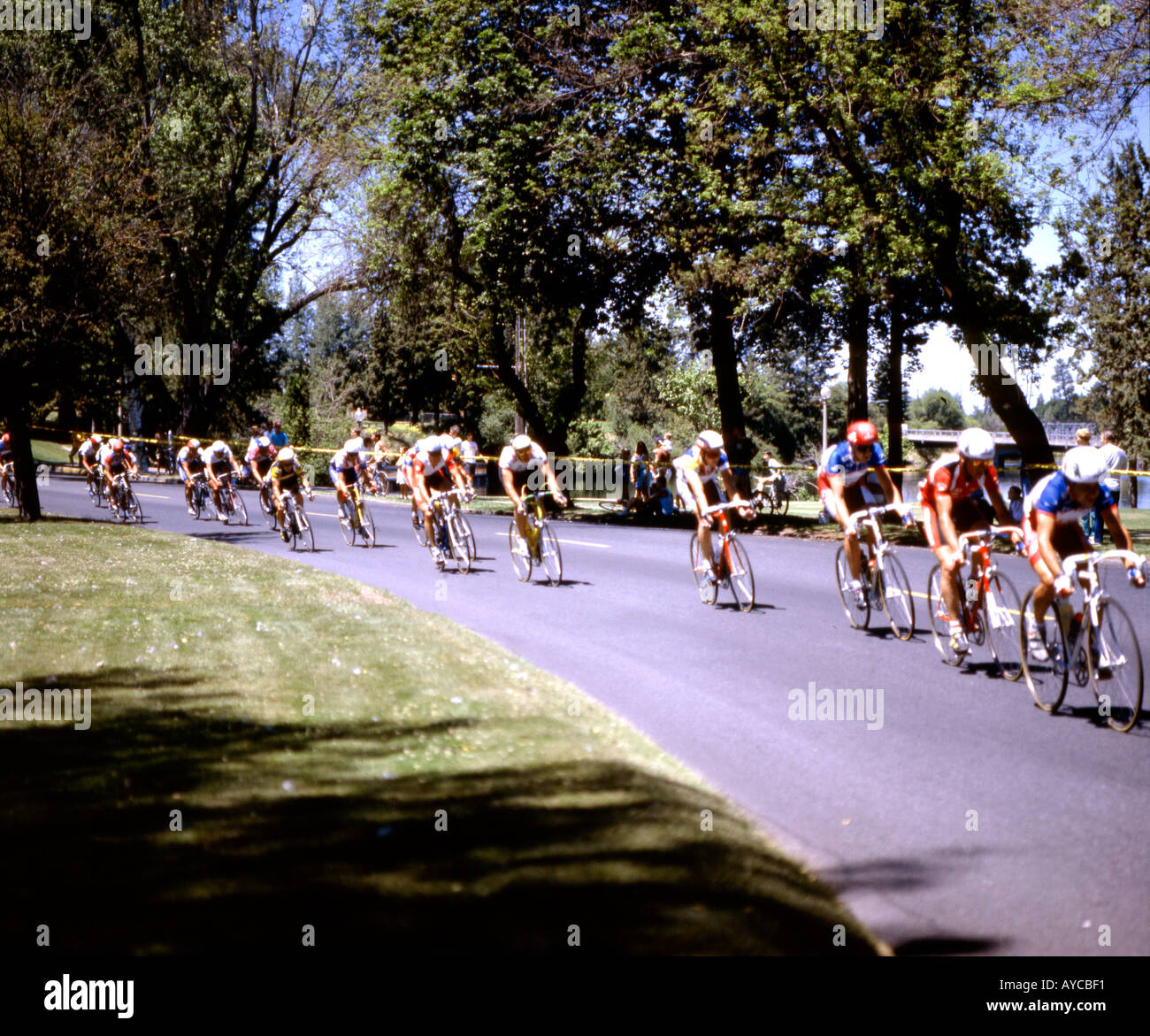 Bicycle riders line the roadway at a competition in Bend in Oregon ...