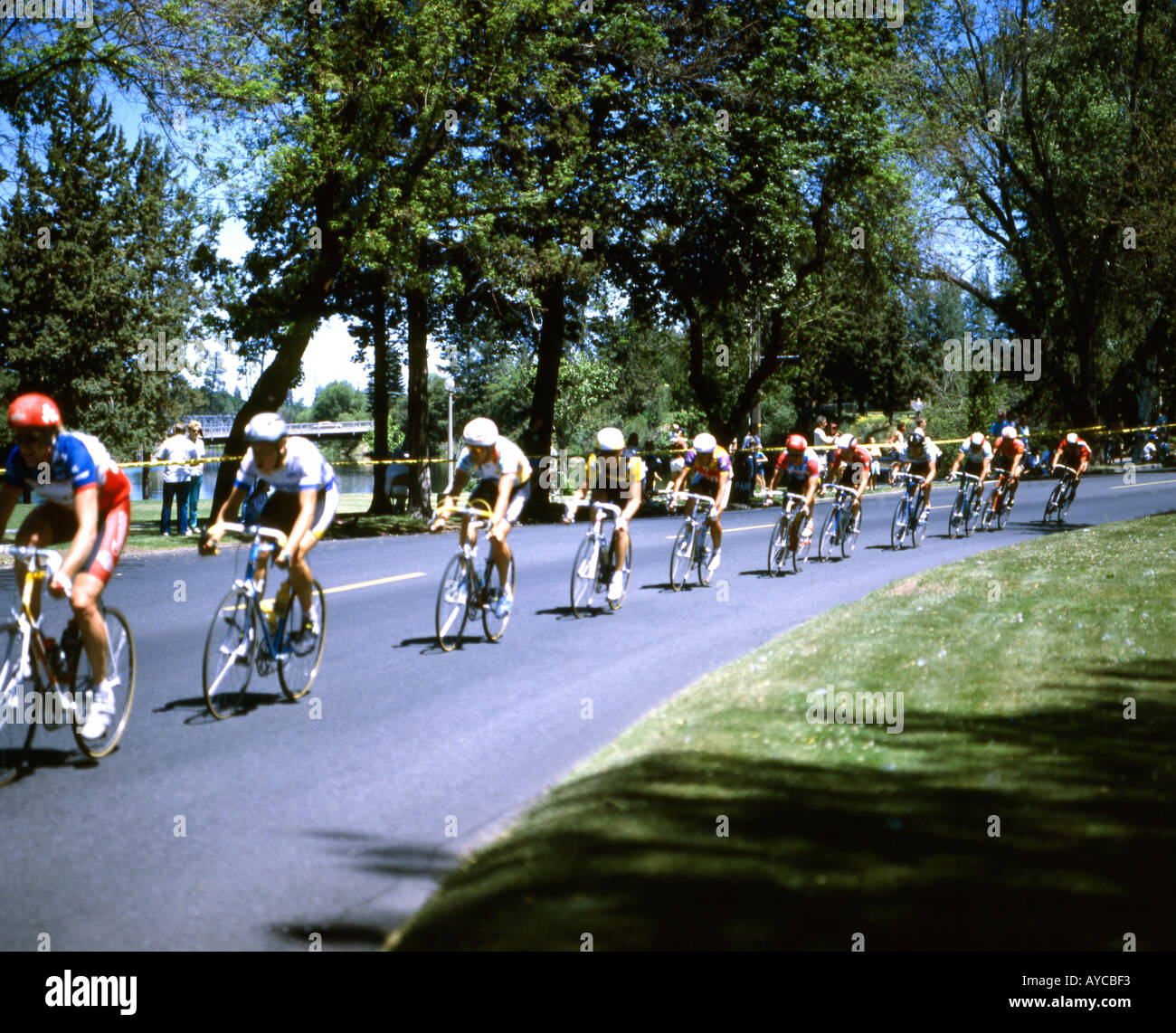 Bicycle riders line the roadway at a competition in Bend in Oregon ...