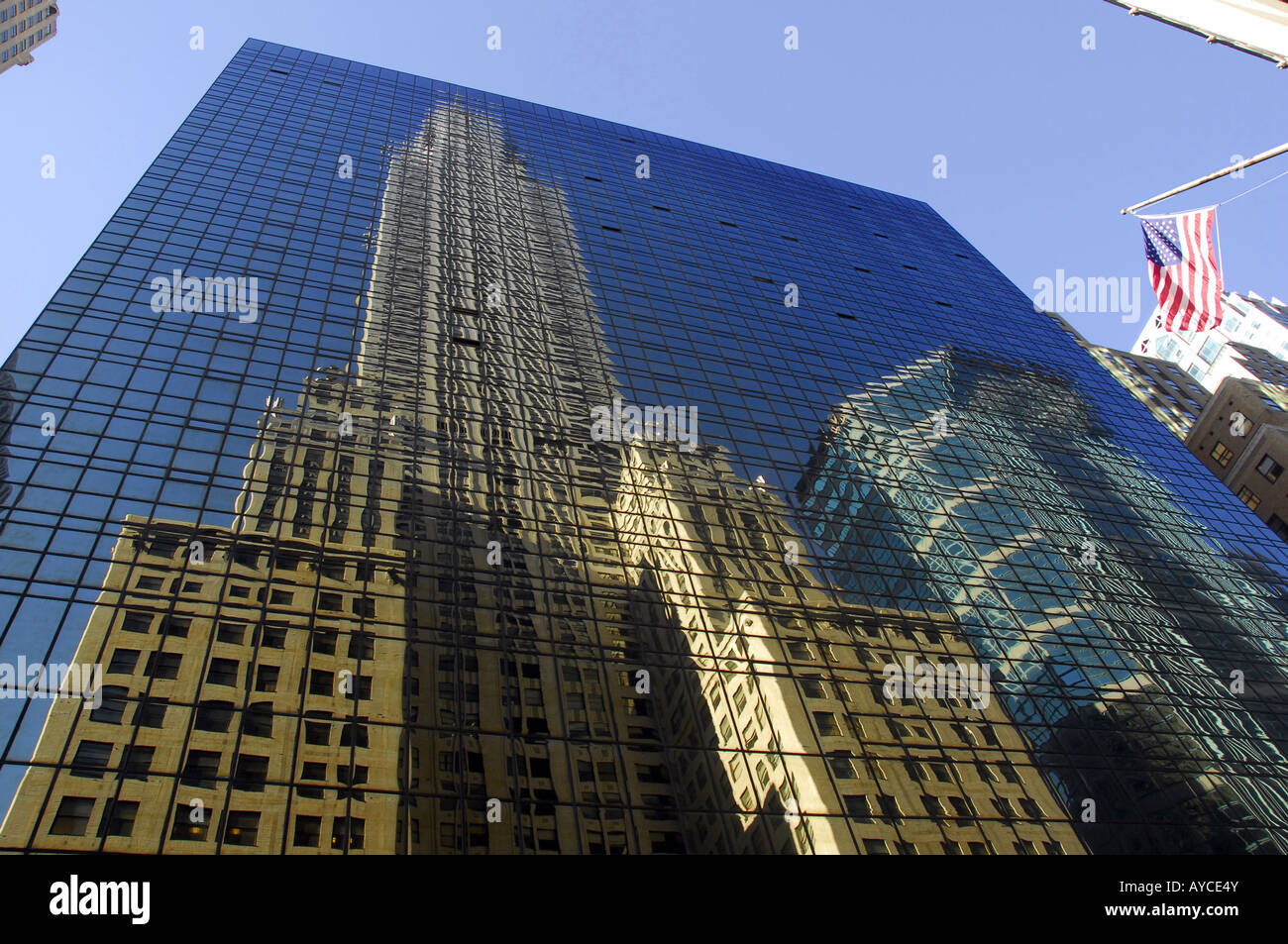 Chrylser Building reflected in the mirrored glass surface of adjacent ...