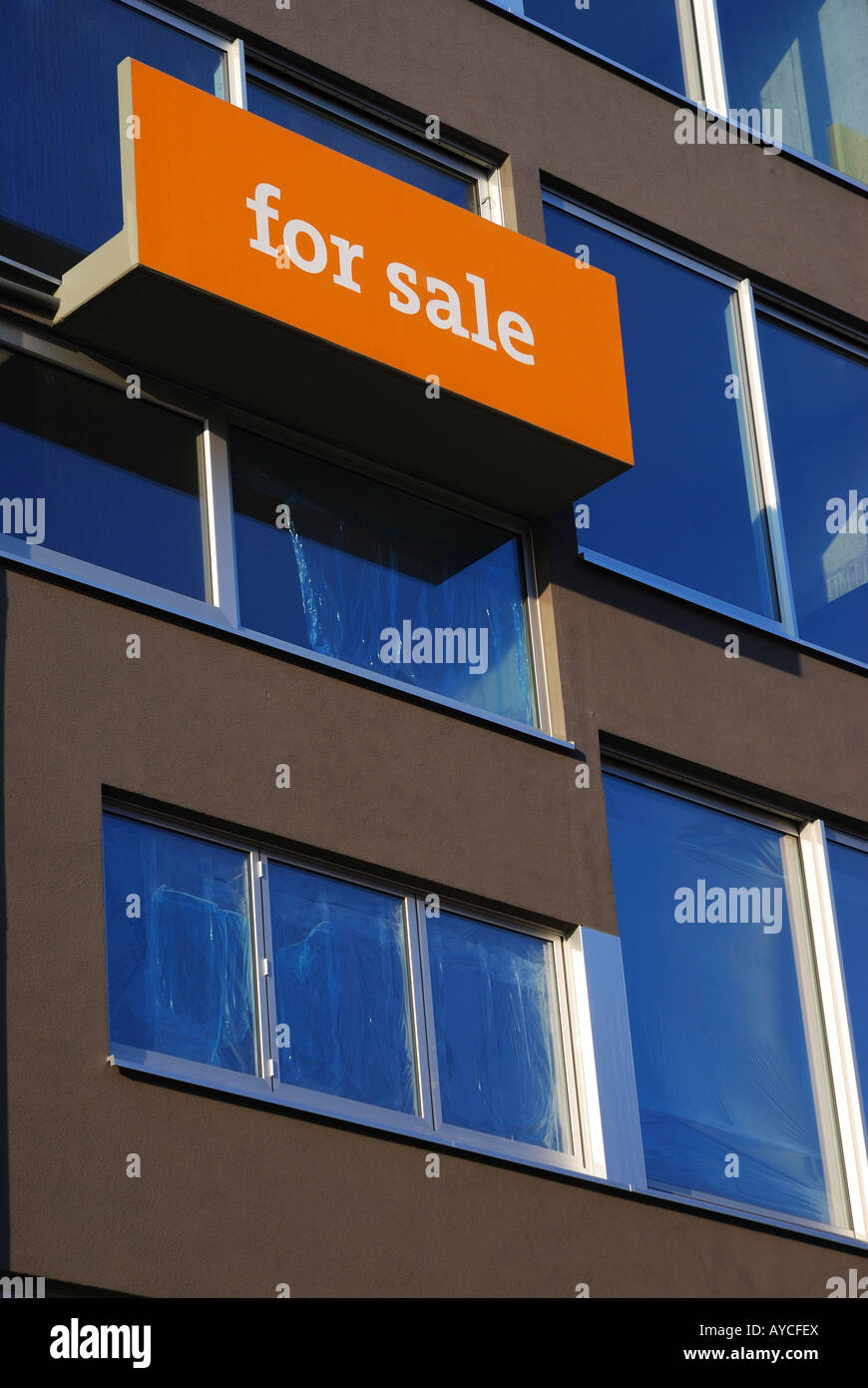 For sale sign on new building Stock Photo - Alamy