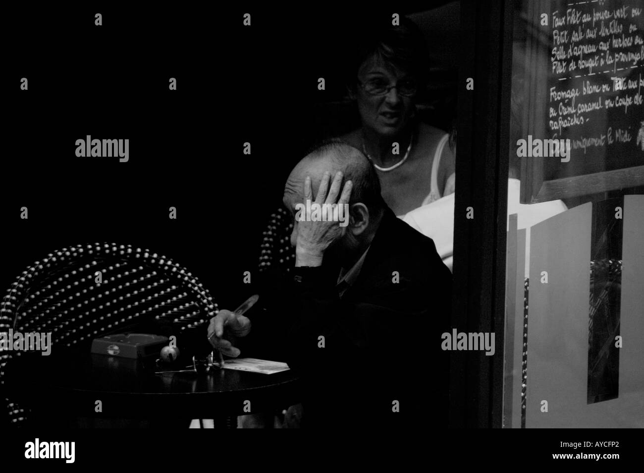 Man writing in Paris cafe Stock Photo - Alamy