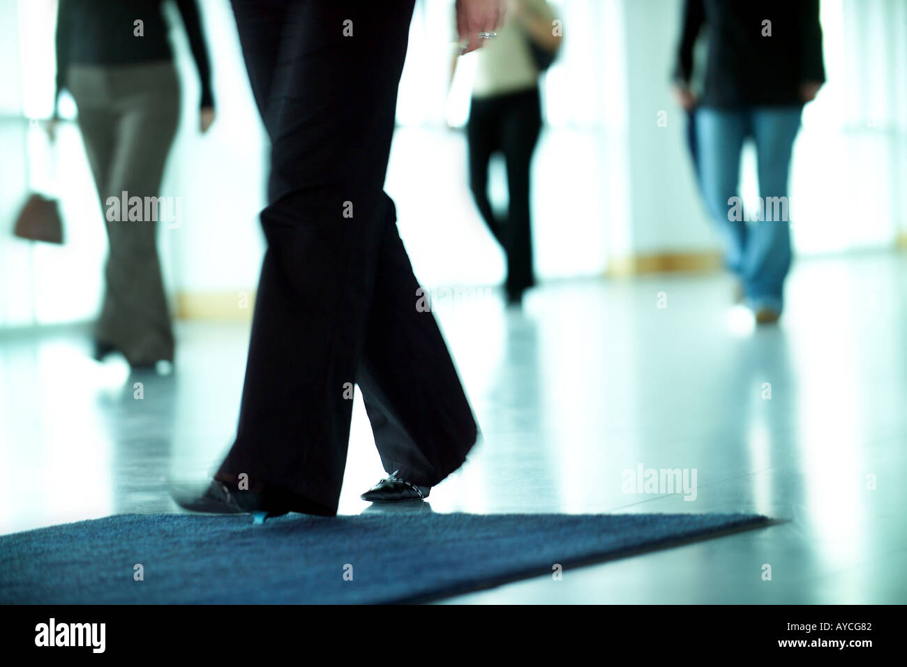 Business people walking through office building Stock Photo - Alamy
