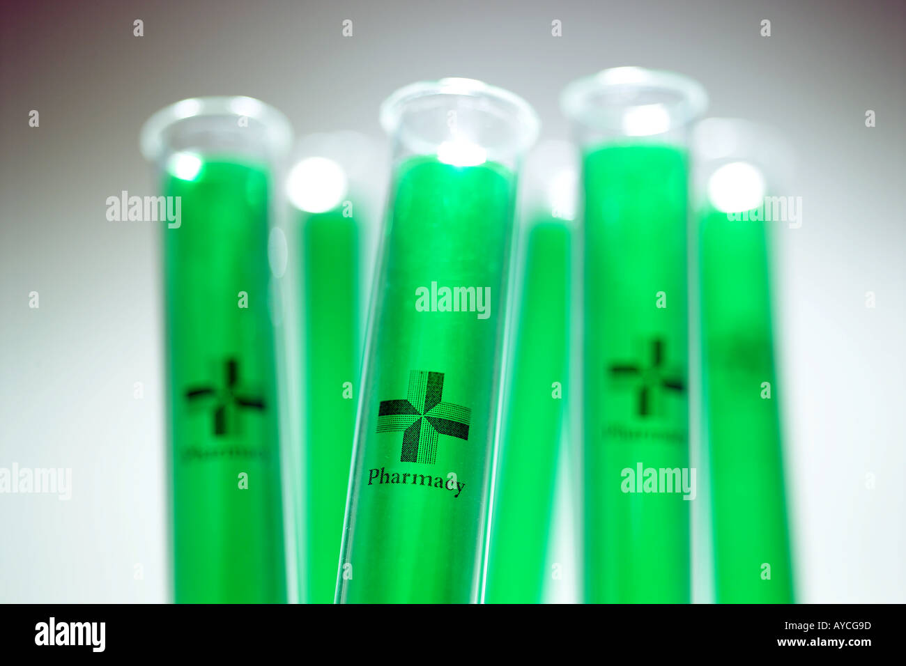 Test tubes with pharmaceutical warning signs, close up Stock Photo - Alamy