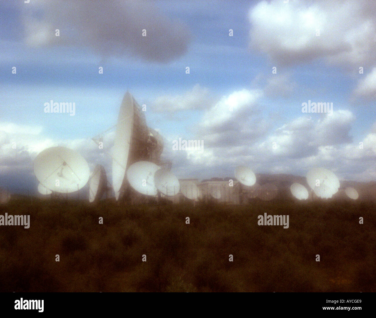 A soft focus image of a satellite dish farm Image was made with a ...