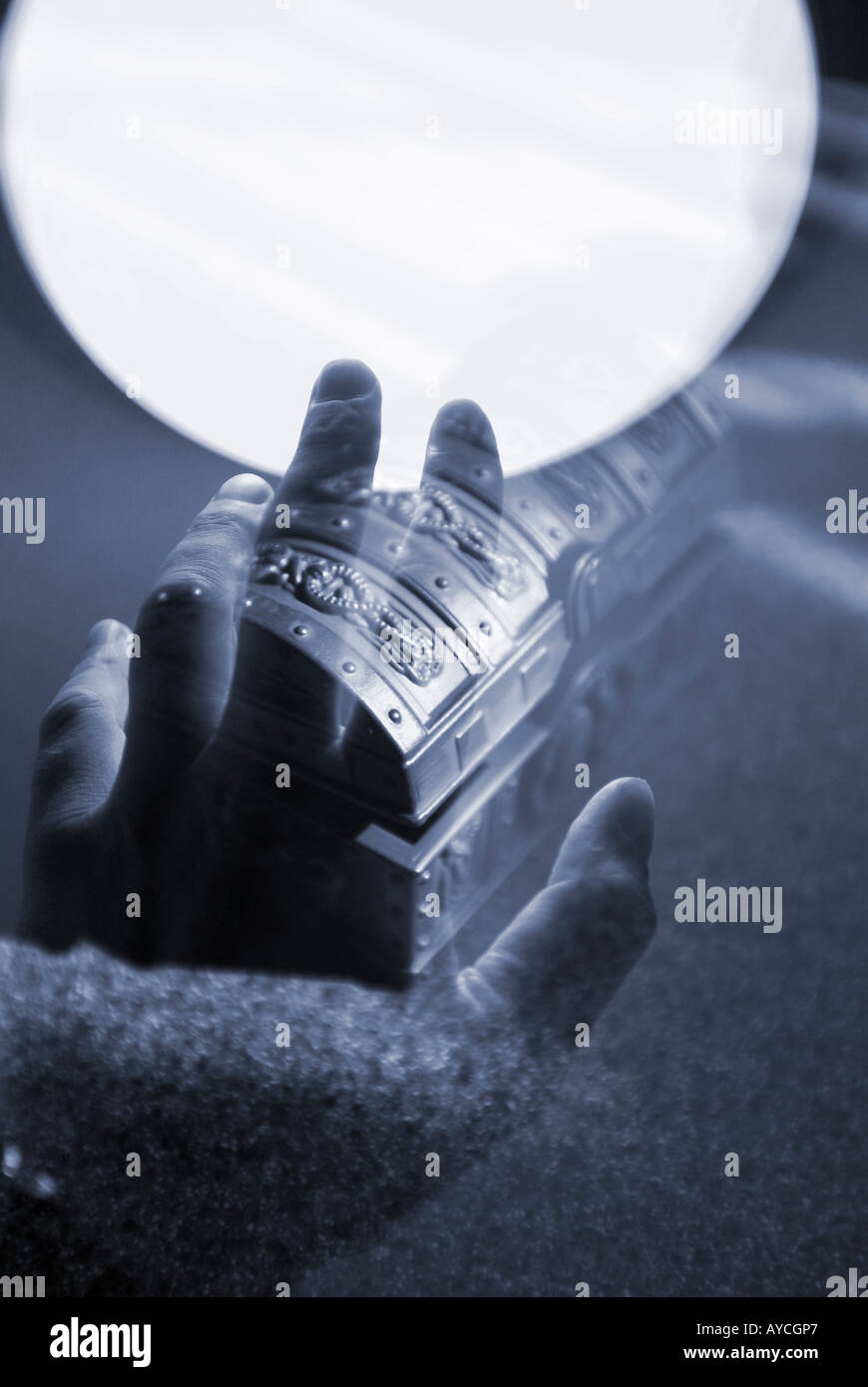 Hand Reaching for a treasure chest collage with light Stock Photo - Alamy