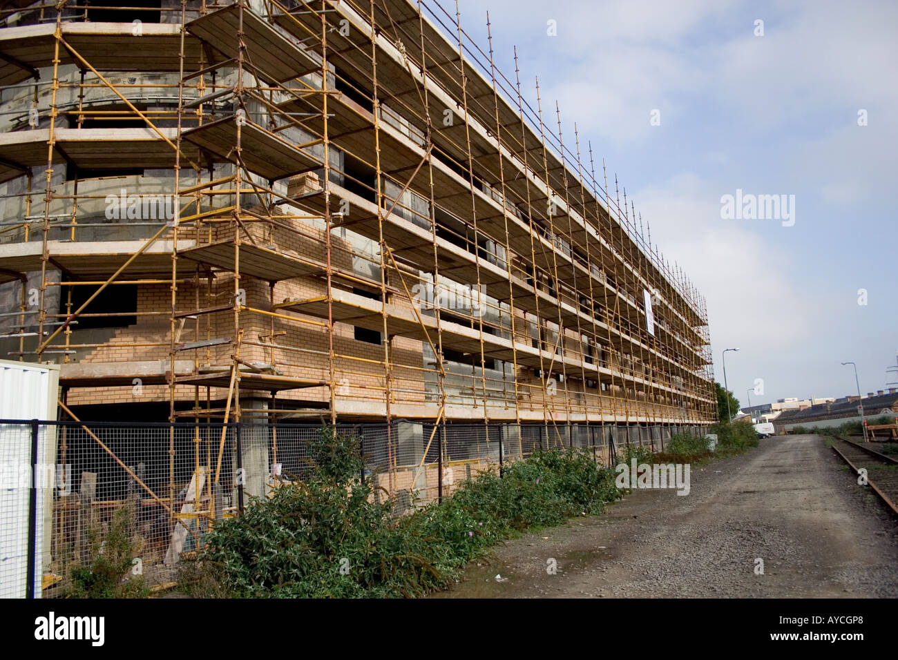 New apartment buildings being erected alongside the railway track in ...