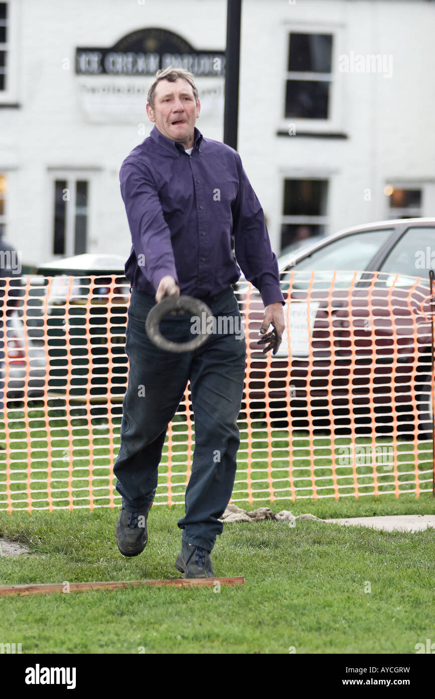 Farmer playing quoits at a country fair in Reeth, North Yorkshire Stock ...