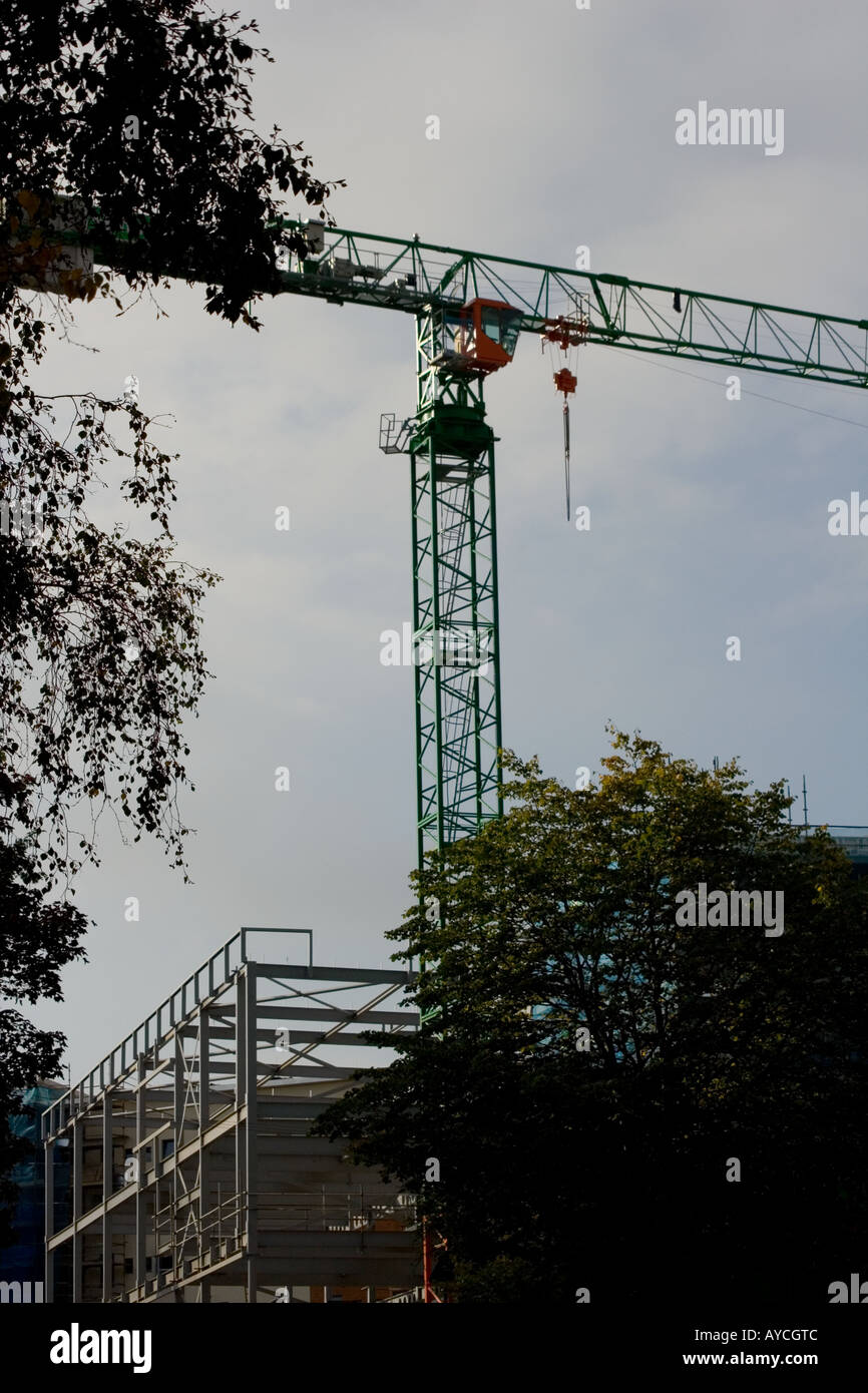 T shaped frame of a Crane high above new development in urban Dundee ...