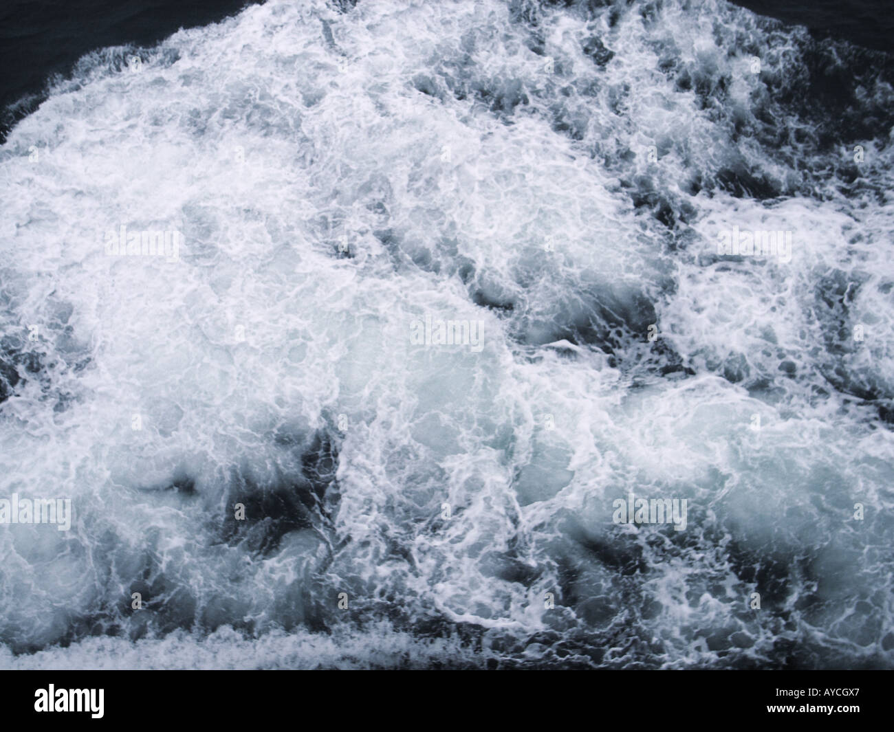 Swirling sea water foam Stock Photo - Alamy