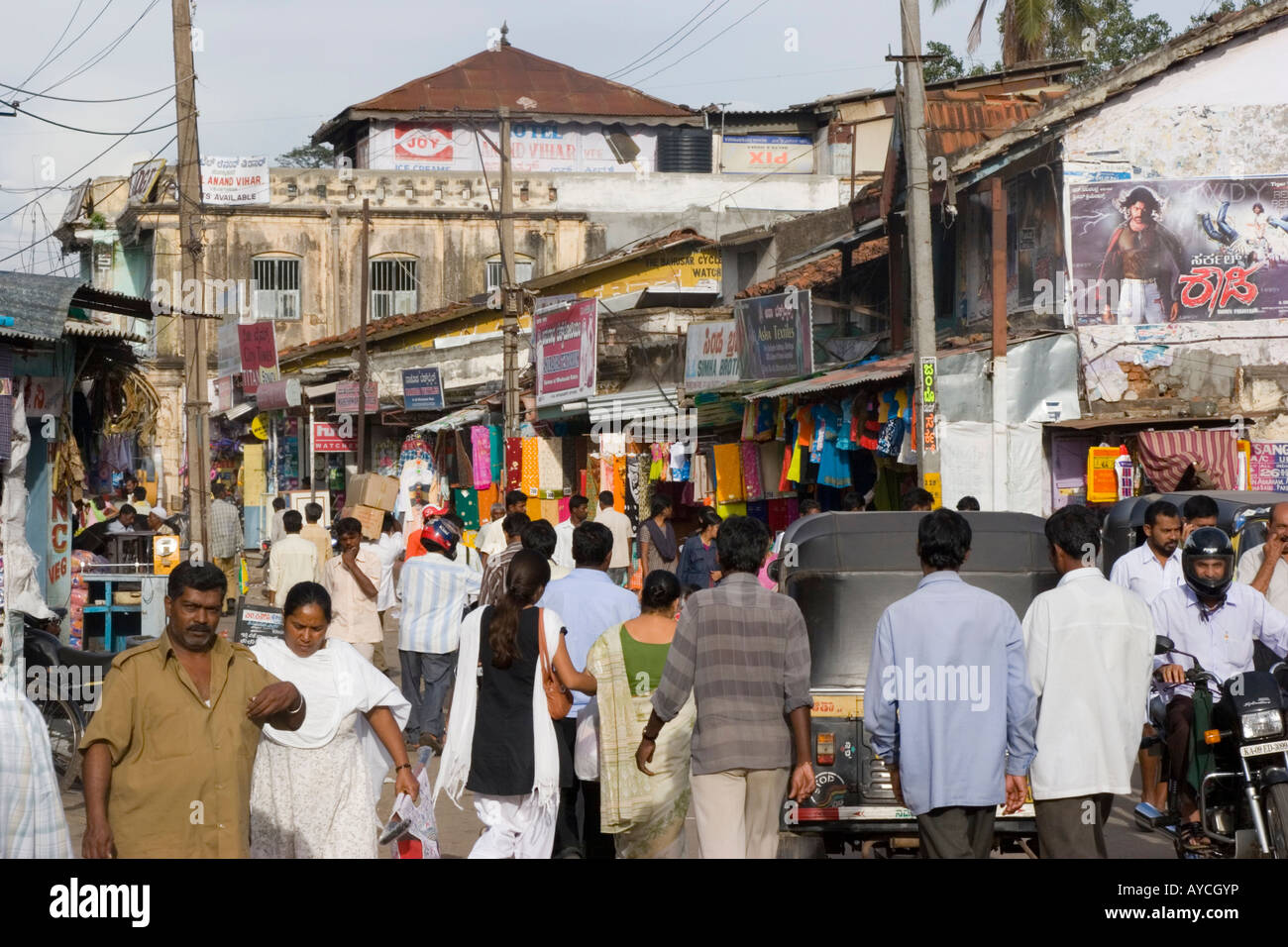 Shops and crowded street scene in Mysore India Stock Photo - Alamy