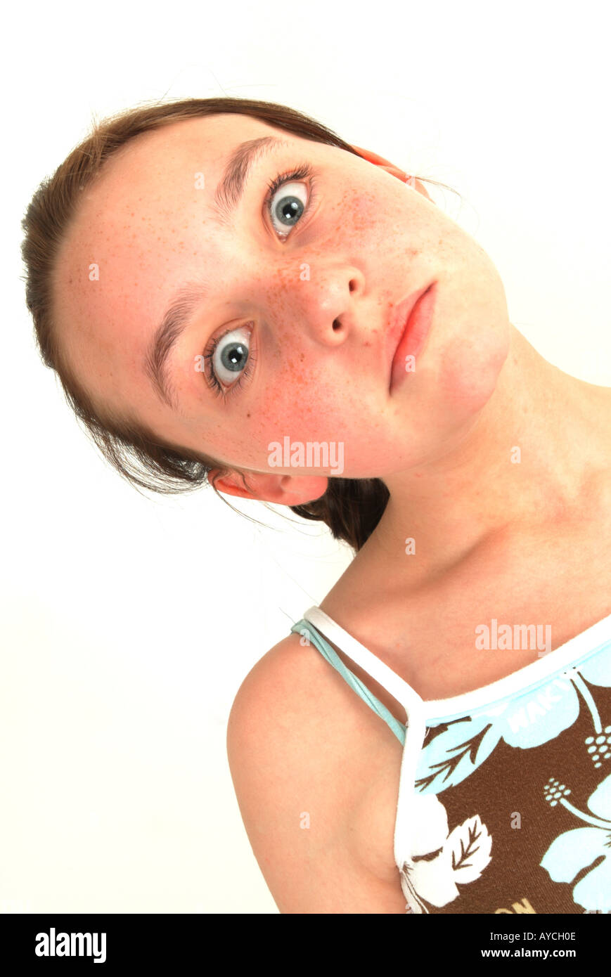 a cheeky girl with her head to the side Stock Photo - Alamy