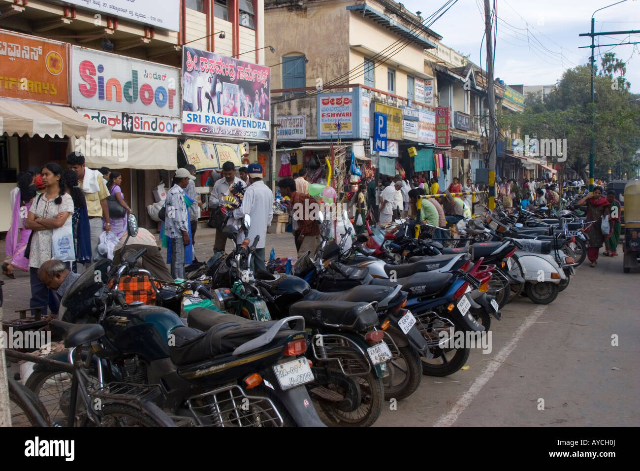 Shops and crowded street scene in Mysore India Stock Photo - Alamy