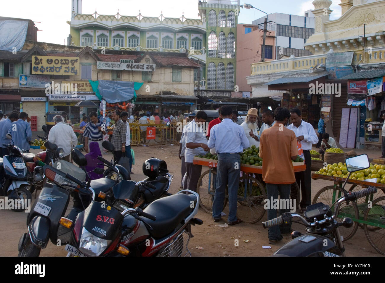 Shops and crowded street scene in Mysore India Stock Photo - Alamy