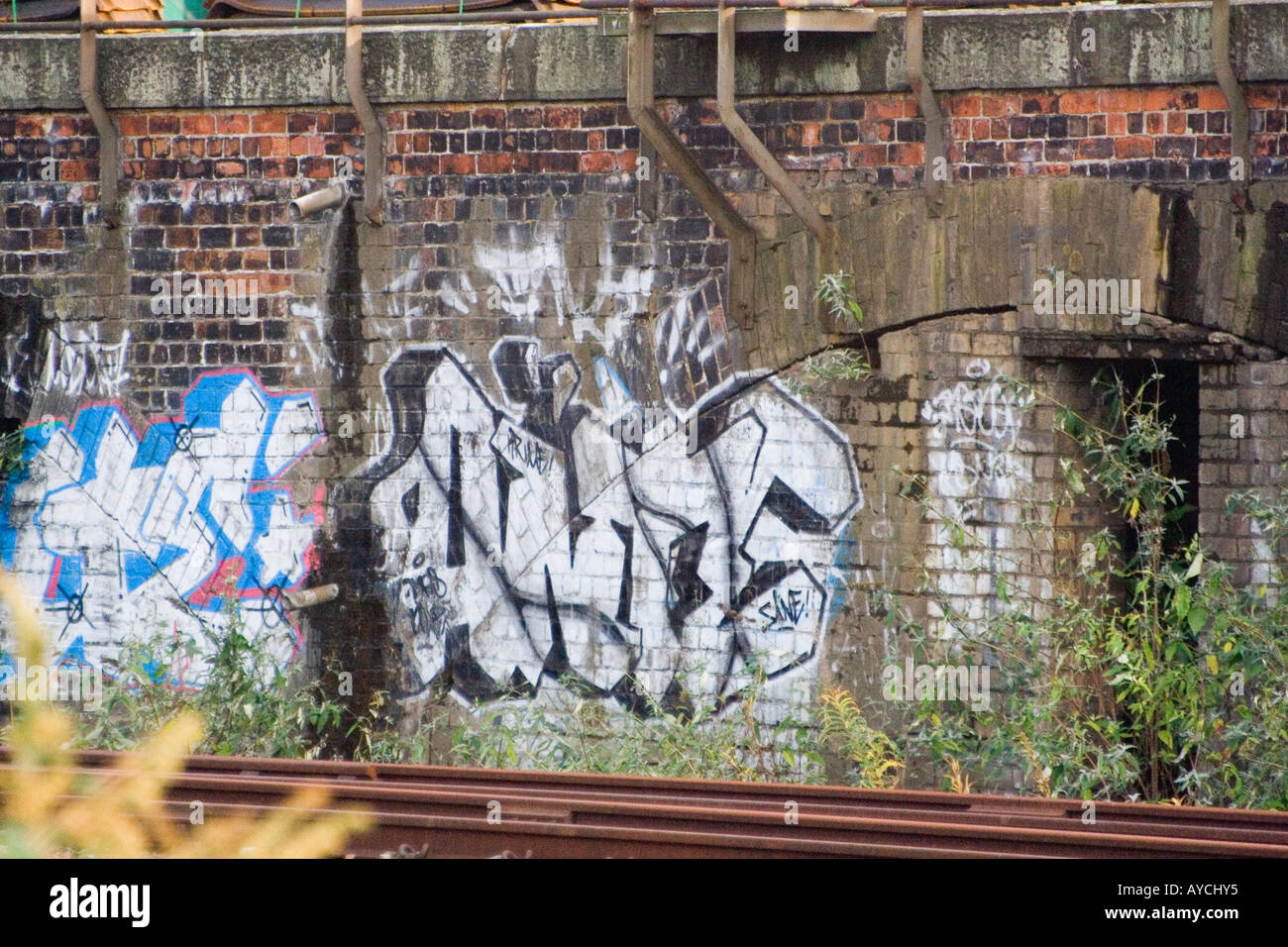 Urban graffiti spray painted on the railway bridge wall in Dundee,UK ...