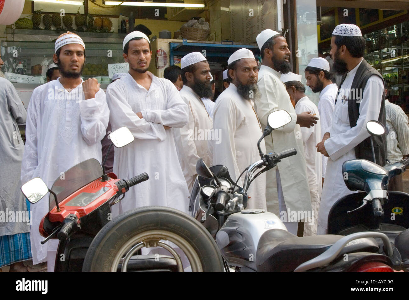 Crowd of moslem men gather in the street outside the mosque in ...