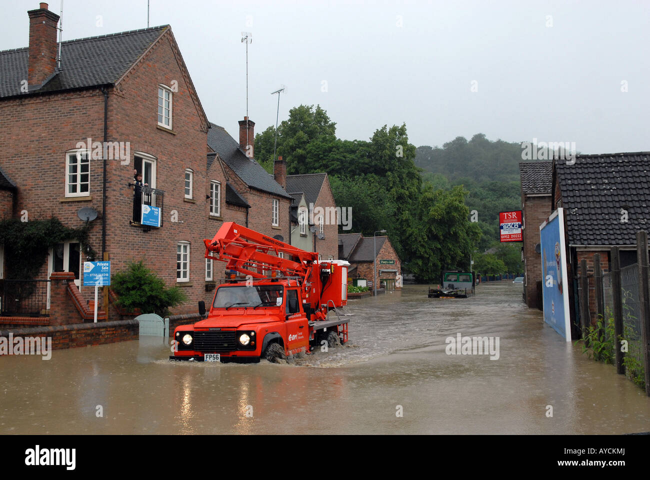 An Eon emergency vehicle makes its way through flood water in ...
