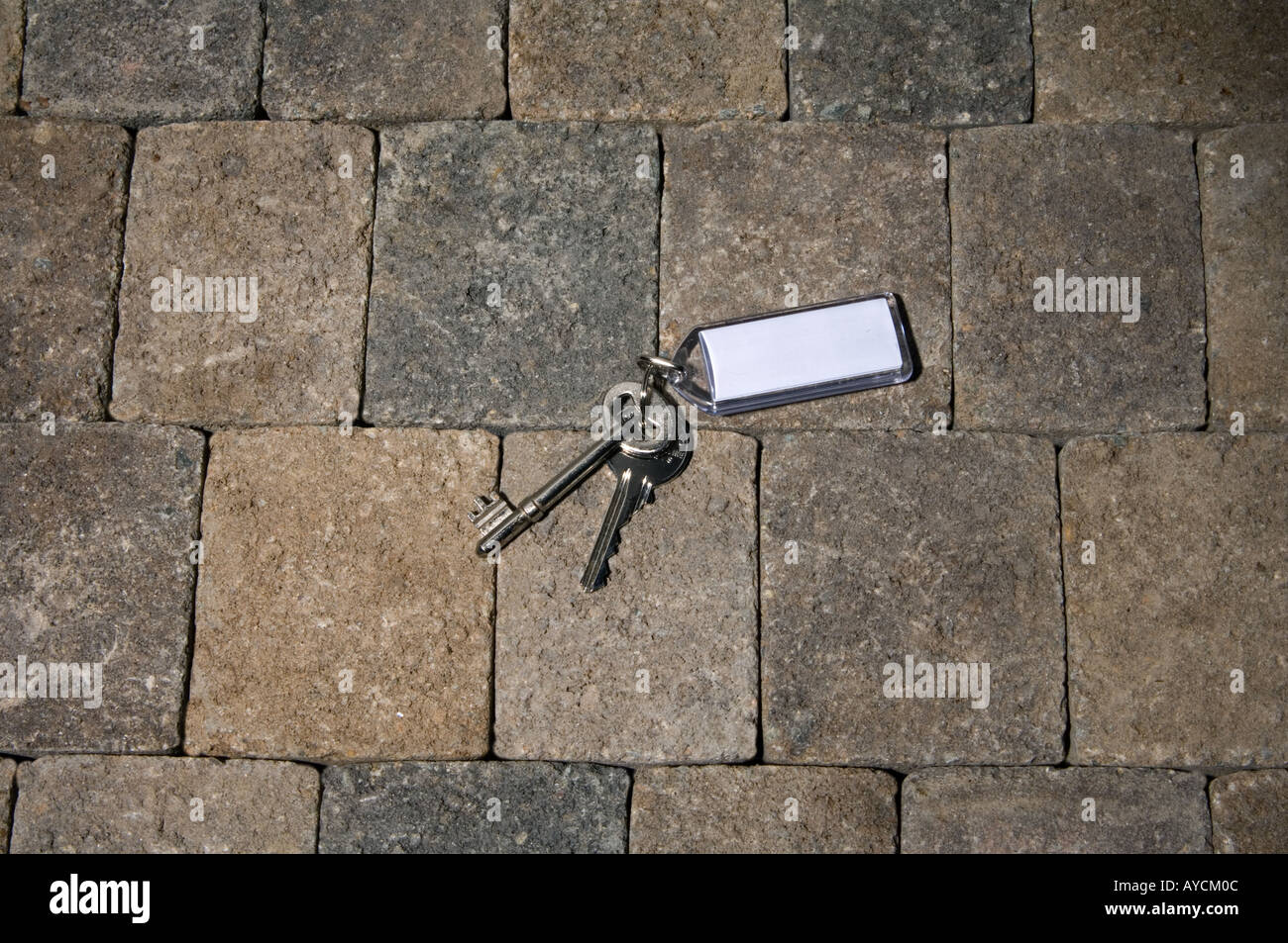 A set of house keys on a brick ground Stock Photo - Alamy
