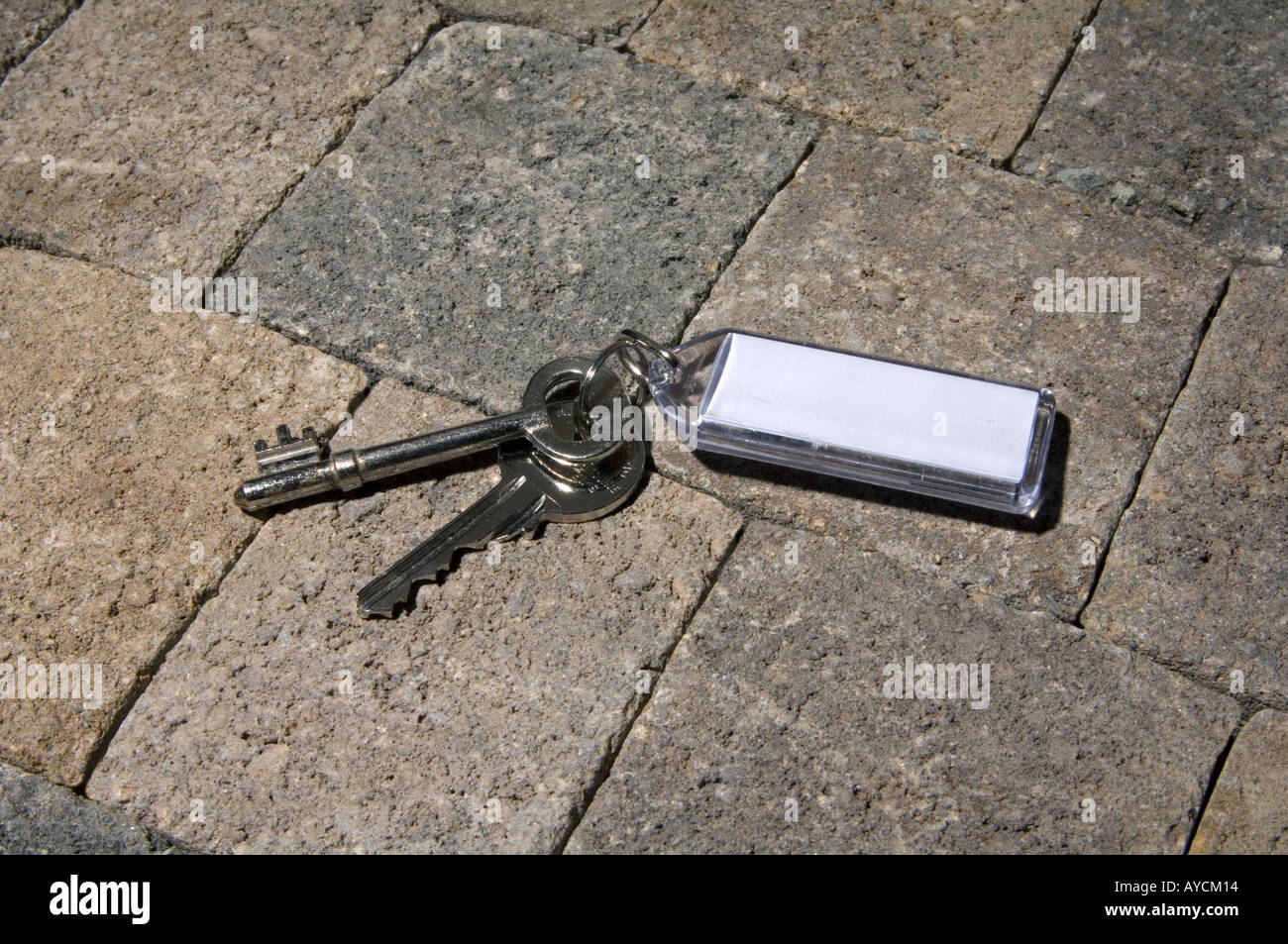 A set of house keys on a brick ground Stock Photo - Alamy