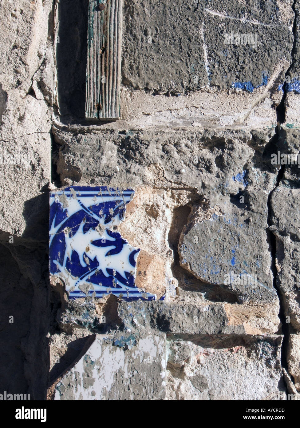 one tile left on demolished wall Stock Photo - Alamy