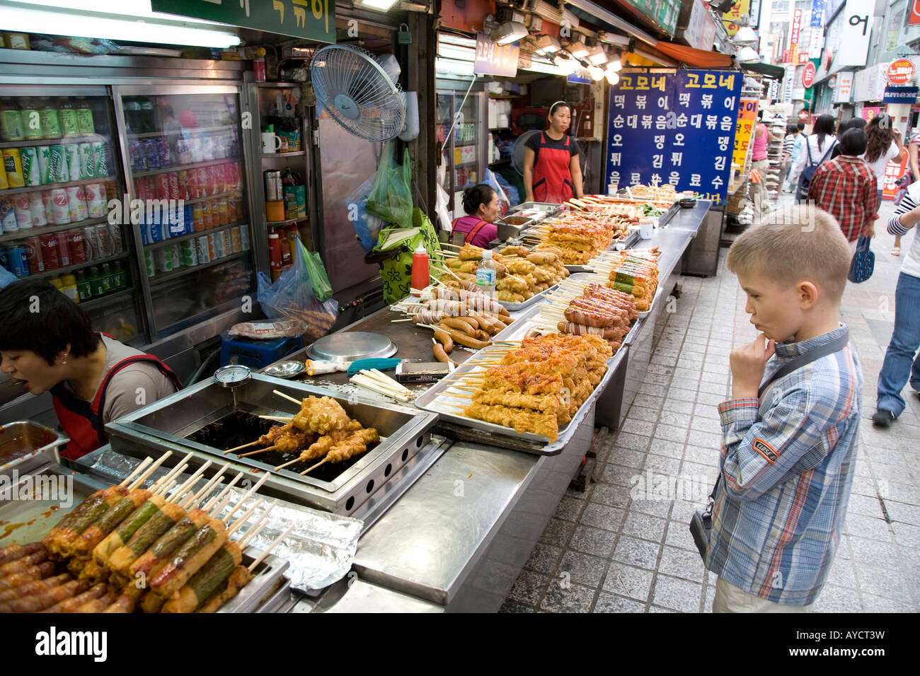 Boy examining Snack in Seoul South Korea Stock Photo - Alamy