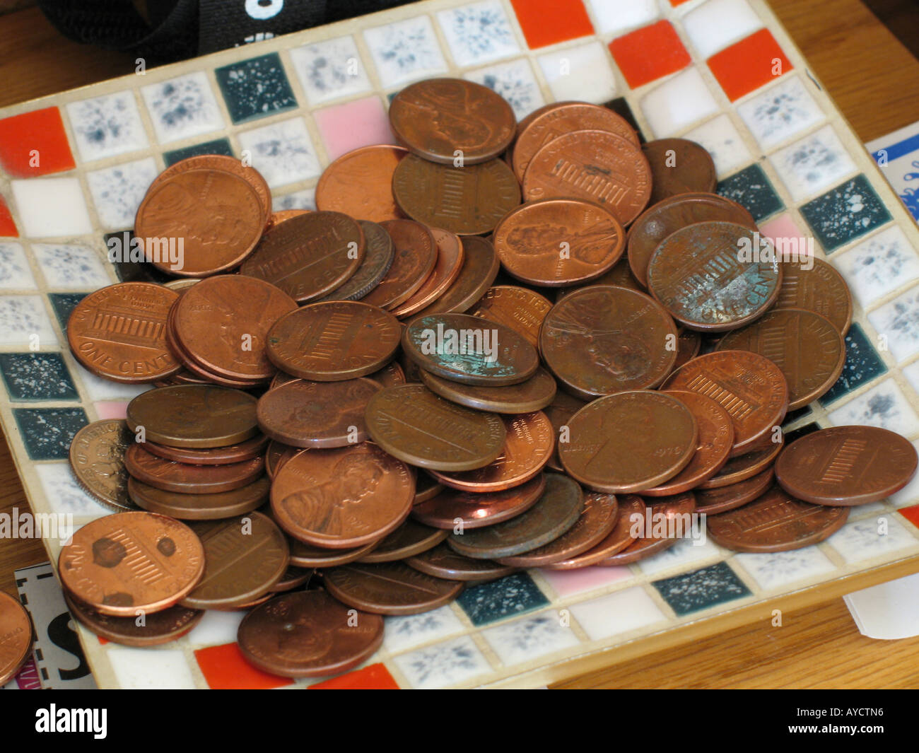 coins in a change dish Stock Photo - Alamy