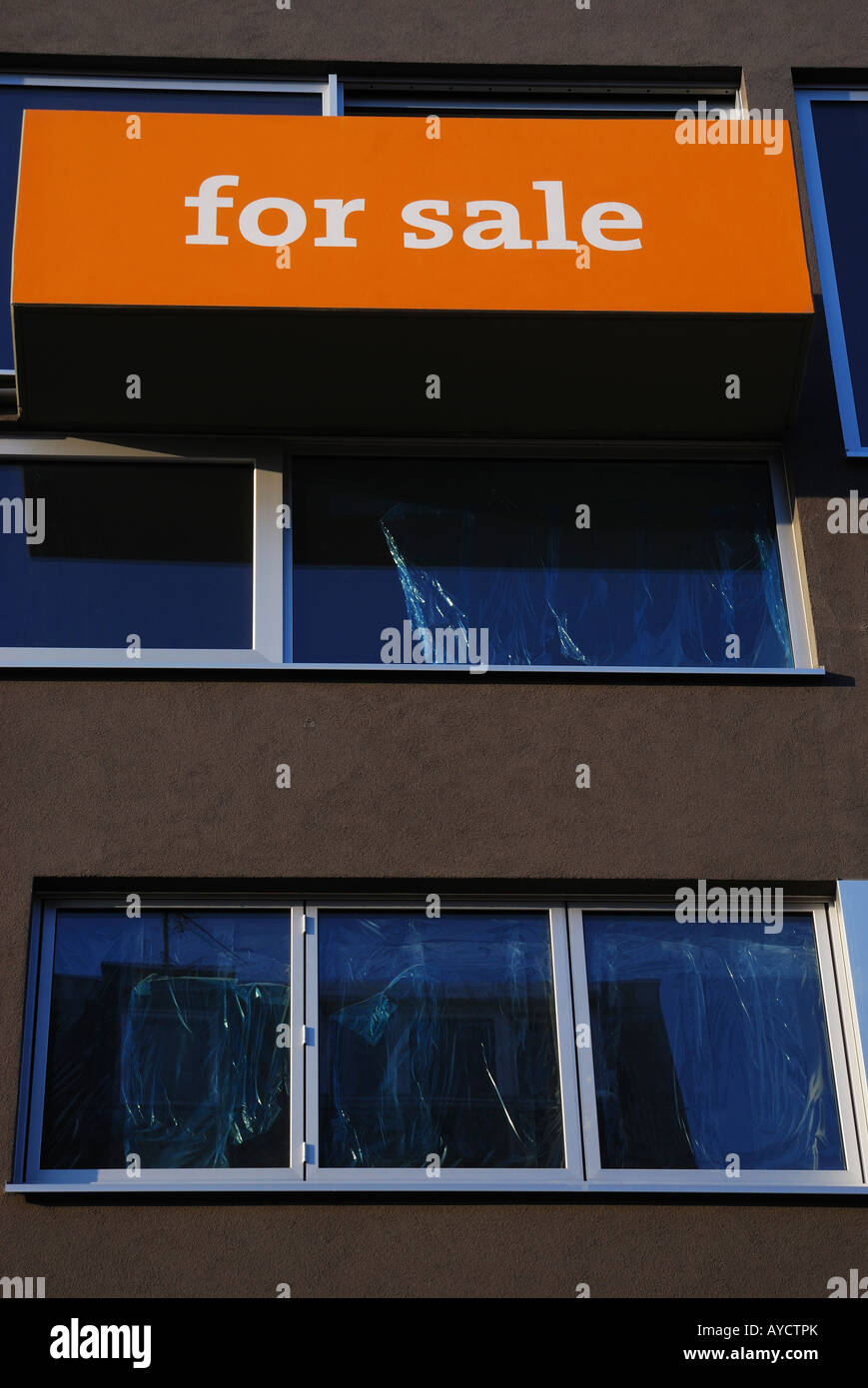 For sale sign on new building Stock Photo - Alamy