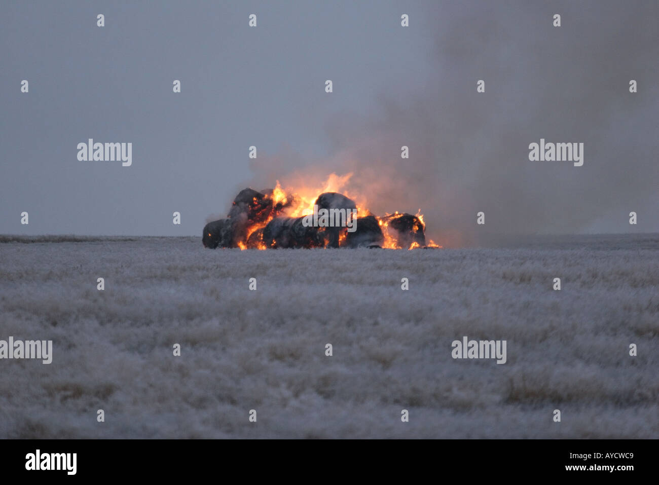 Old hay bales set on fire in scenic Saskatchewan Stock Photo - Alamy
