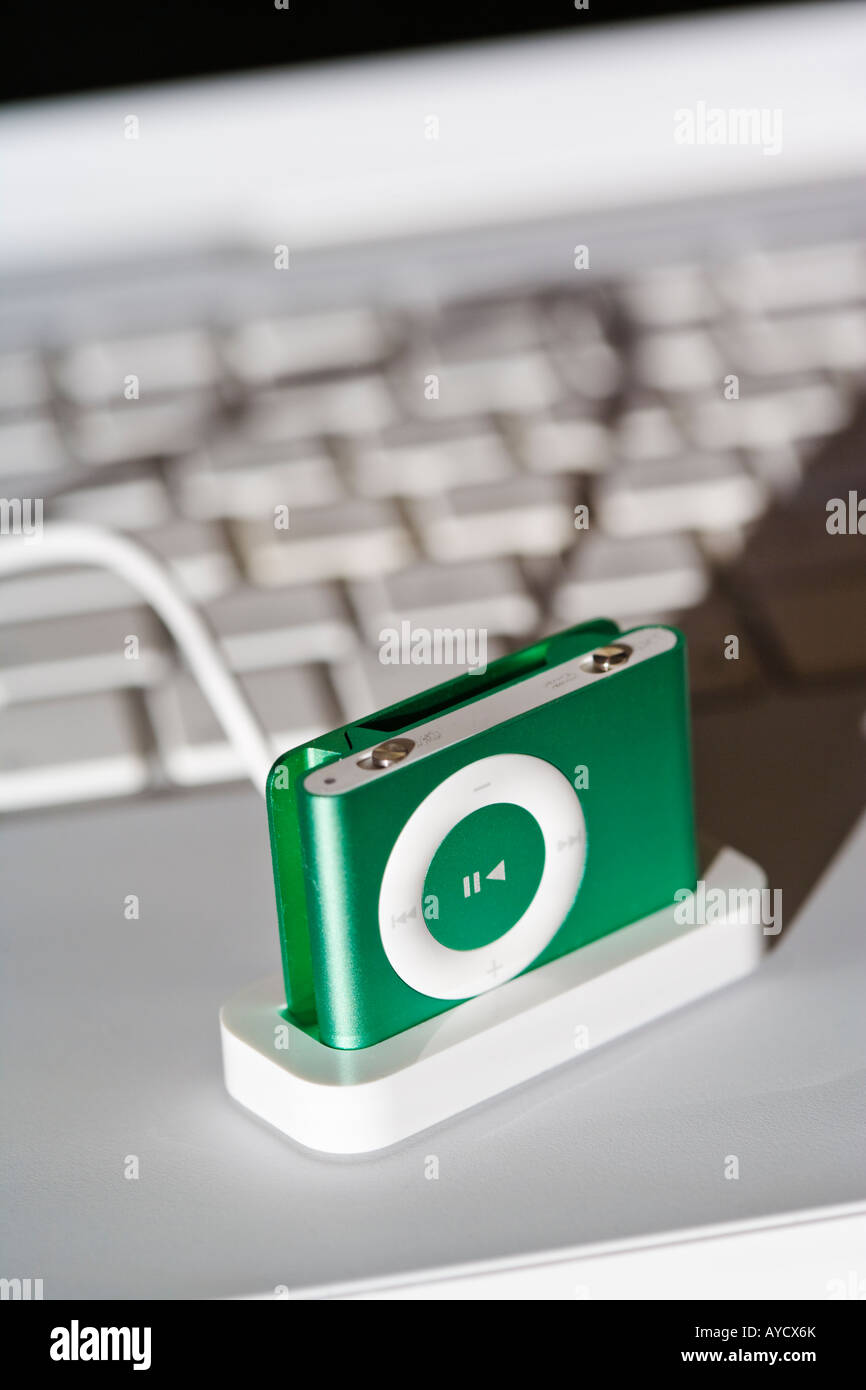 green ipod shuffle sitting on a laptop computer Stock Photo - Alamy