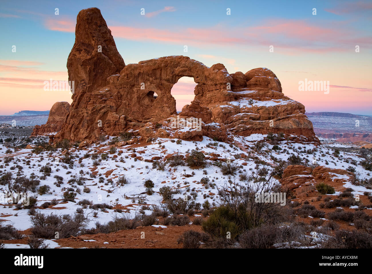 Sunrise glow on Turret Arch with winter snow at Turret Arch at Arches ...