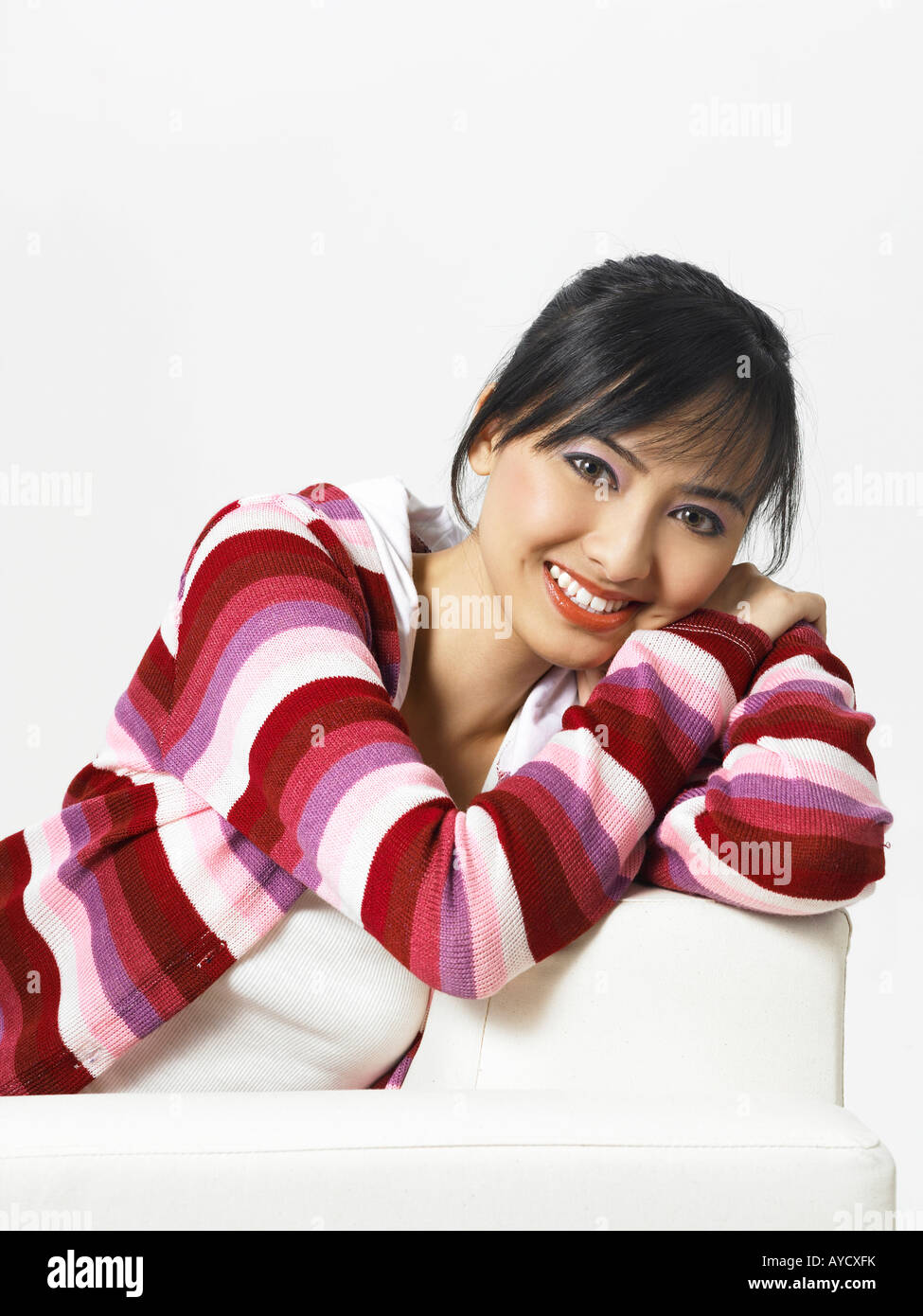 Portrait woman sitting on couch Cut Out Stock Images & Pictures - Alamy