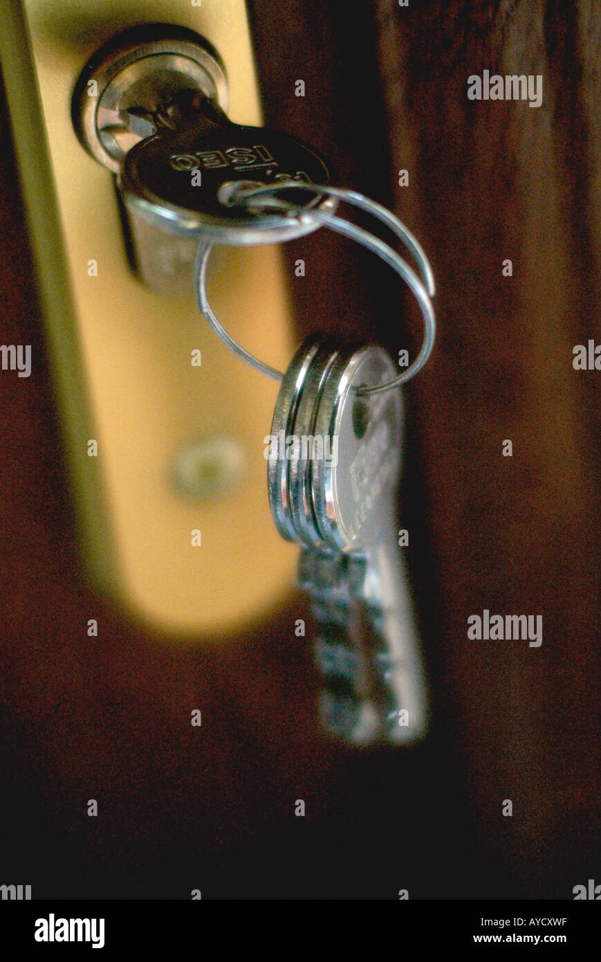 keys hanging in door lock Stock Photo - Alamy