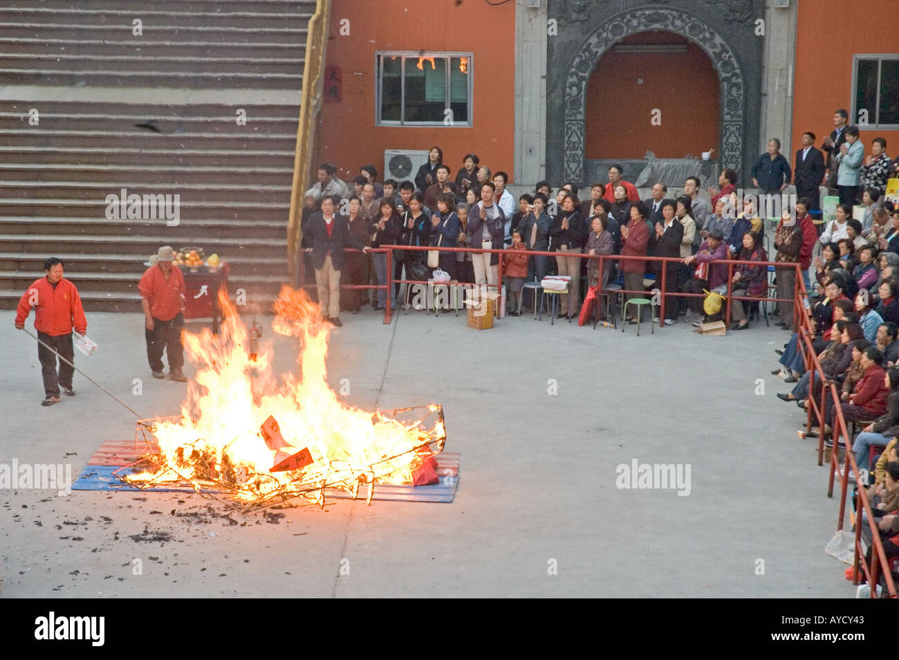 Burning offerings during a Buddhist religious ceremony at Jingan Temple ...