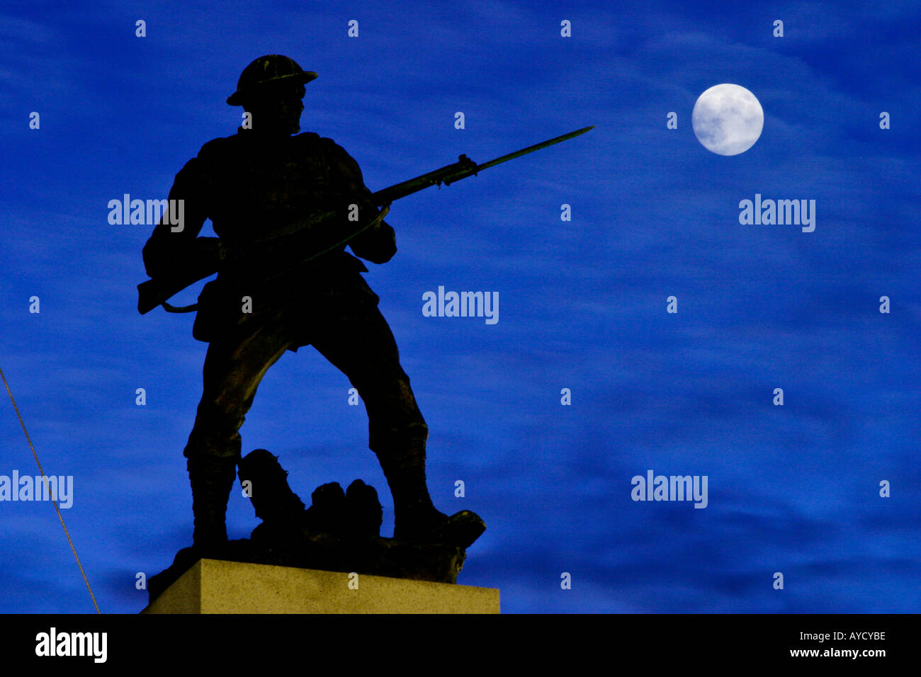 Silhouetted statue of unknown soldier and full moon at dusk-Note ...